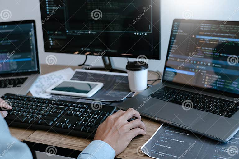 Programmer Working on Computer in it Office Typing Data Coding in Software and Checking Code on ...