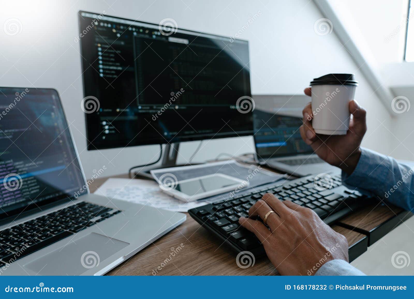 Programmer Working on Computer in it Office Typing Data Coding in Software and Checking Code on ...