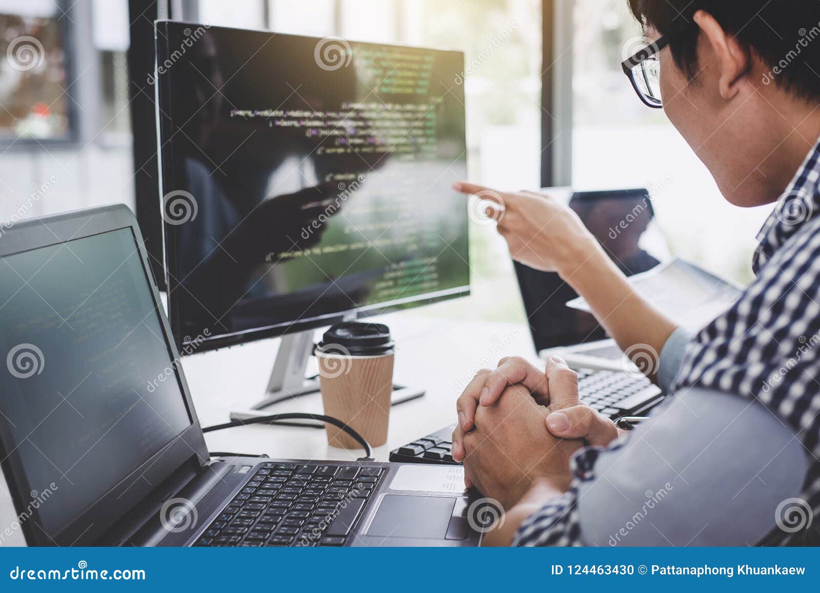 Programmers Cooperating at Developing Programming and Website Working in a Software Develop ...