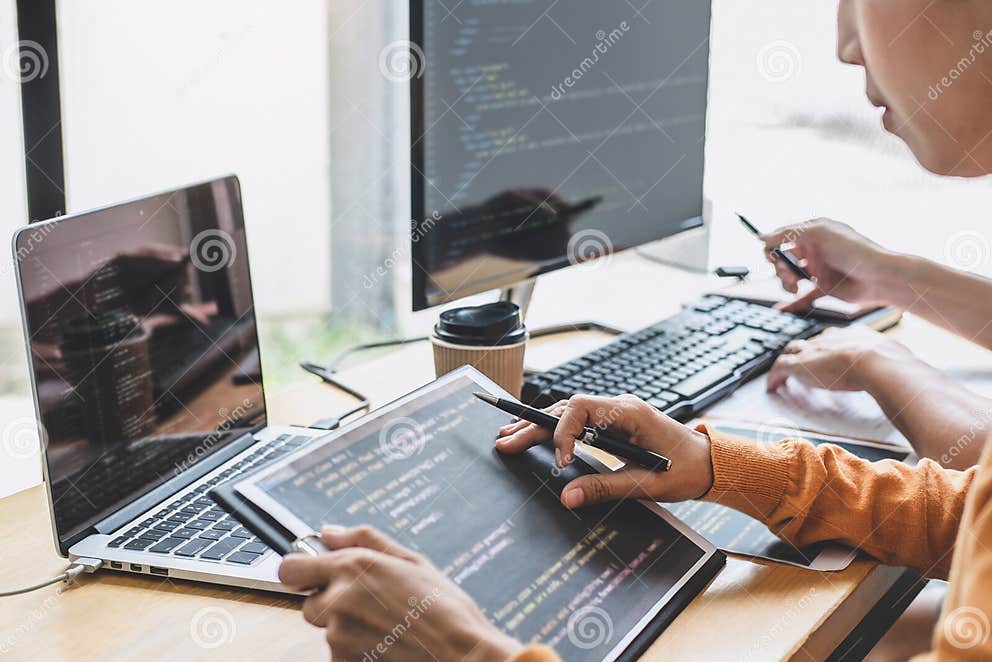 Programmers Cooperating at Developing Programming and Website Working ...