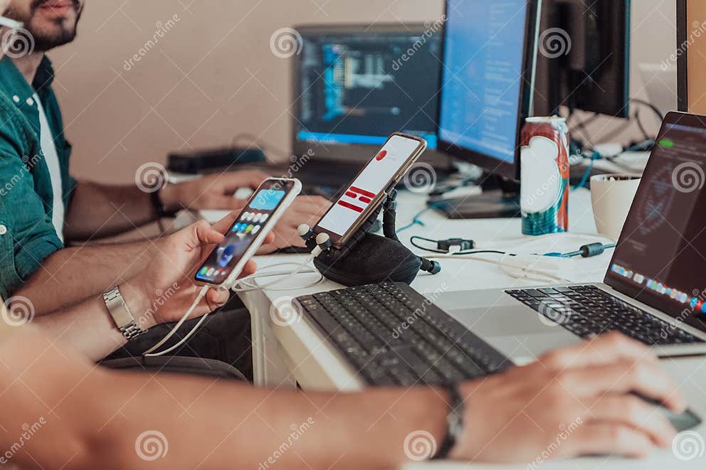 Programmers Engrossed in Deep Collaboration, Diligently Working Together To Solve Complex ...