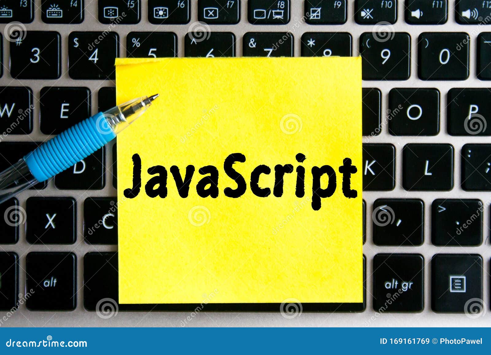 Programming Language Inscription `javascript` On A Yellow Sheet Of Sticker Paper On The