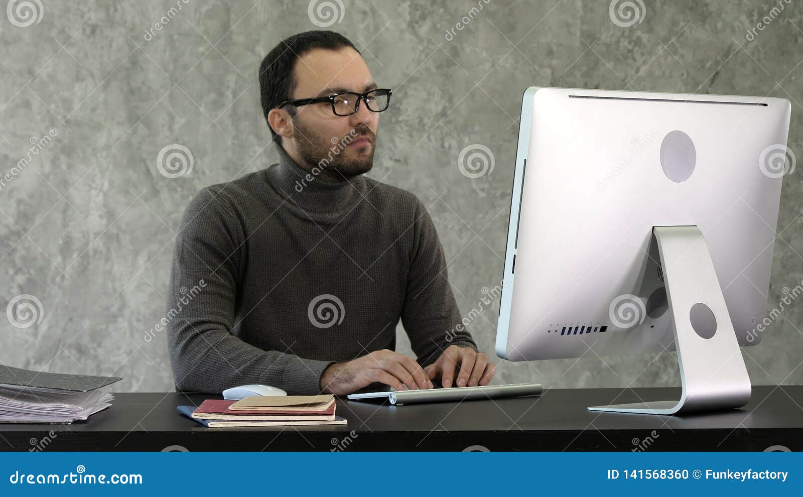 Programming Man Working On Computer In It Office Sitting At Desk