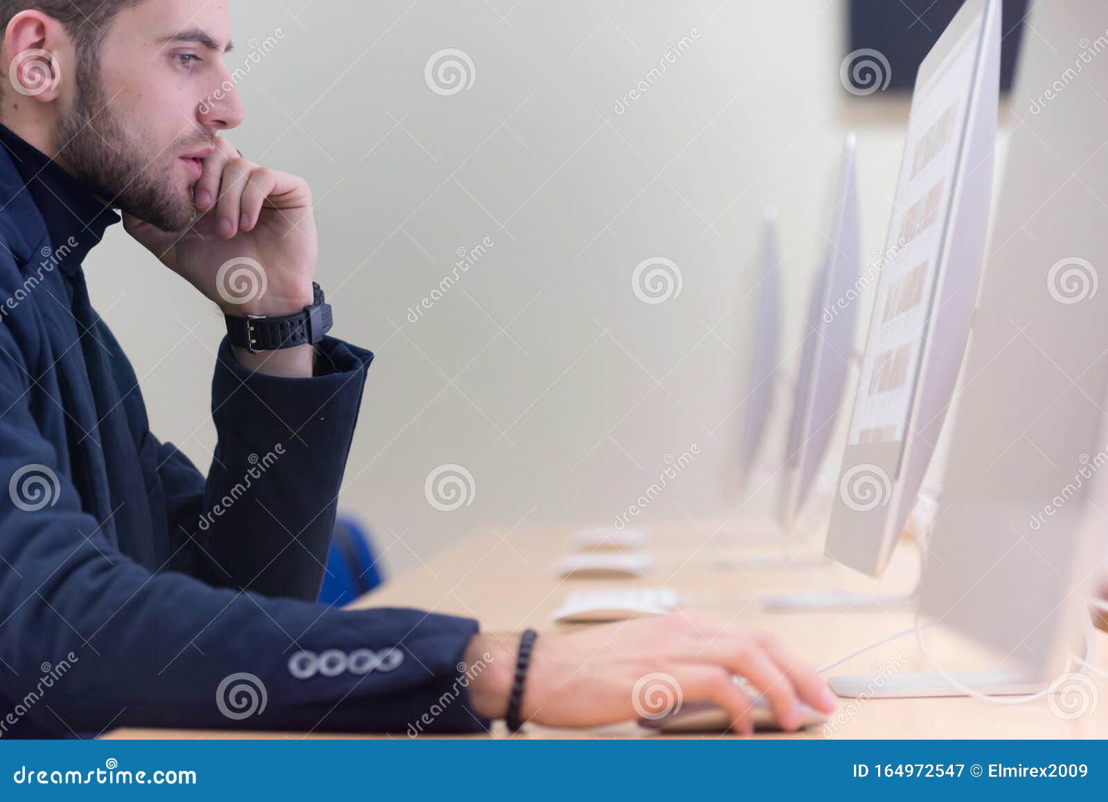 Programming Man Working On Computer In It Office Sitting At Desk