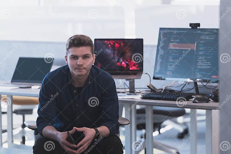 Programming Man Working On Computer In It Office Sitting At Desk