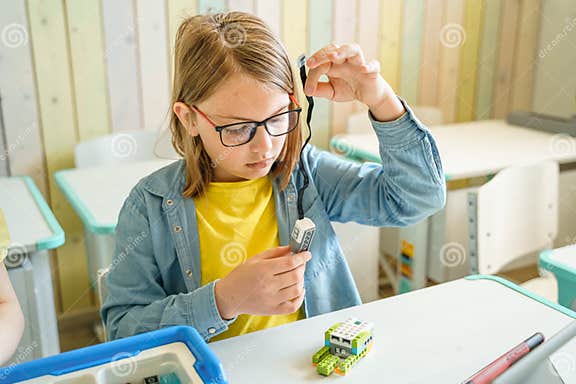 Programming Work, Learning Robotics in Elementary School. Children Students Assembly, Launch ...