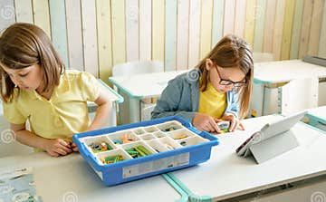 Programming Work, Learning Robotics in Elementary School. Children Students Assembly, Launch ...