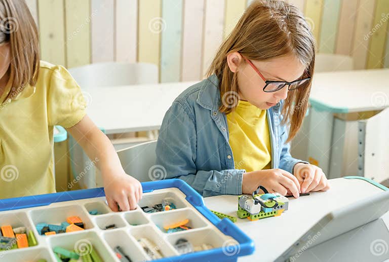 Programming Work, Learning Robotics in Elementary School. Children Students Assembly, Launch ...