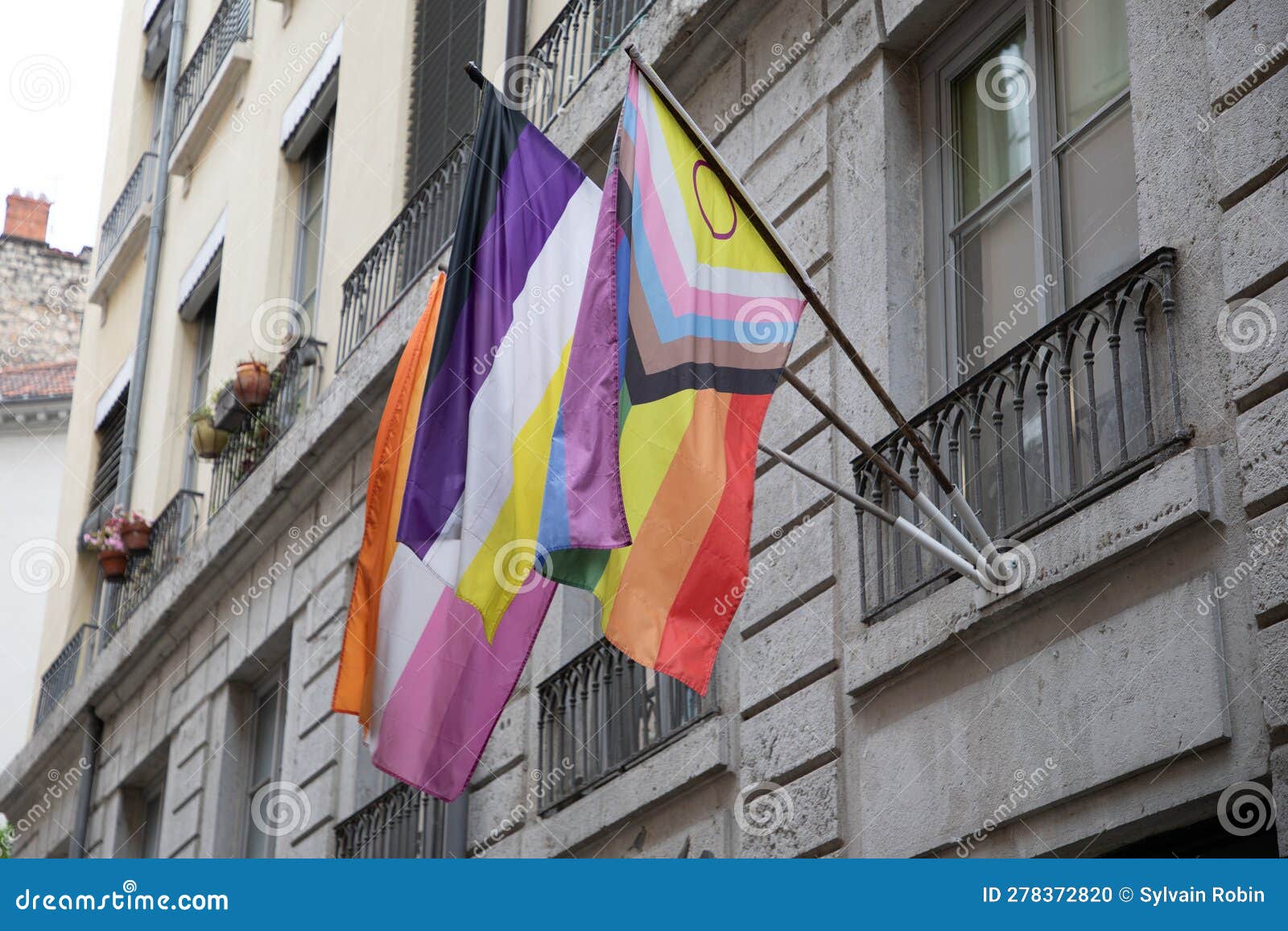 Progress LGBTQ Progress Rainbow Flag Waving in the Wind Wall Facade ...