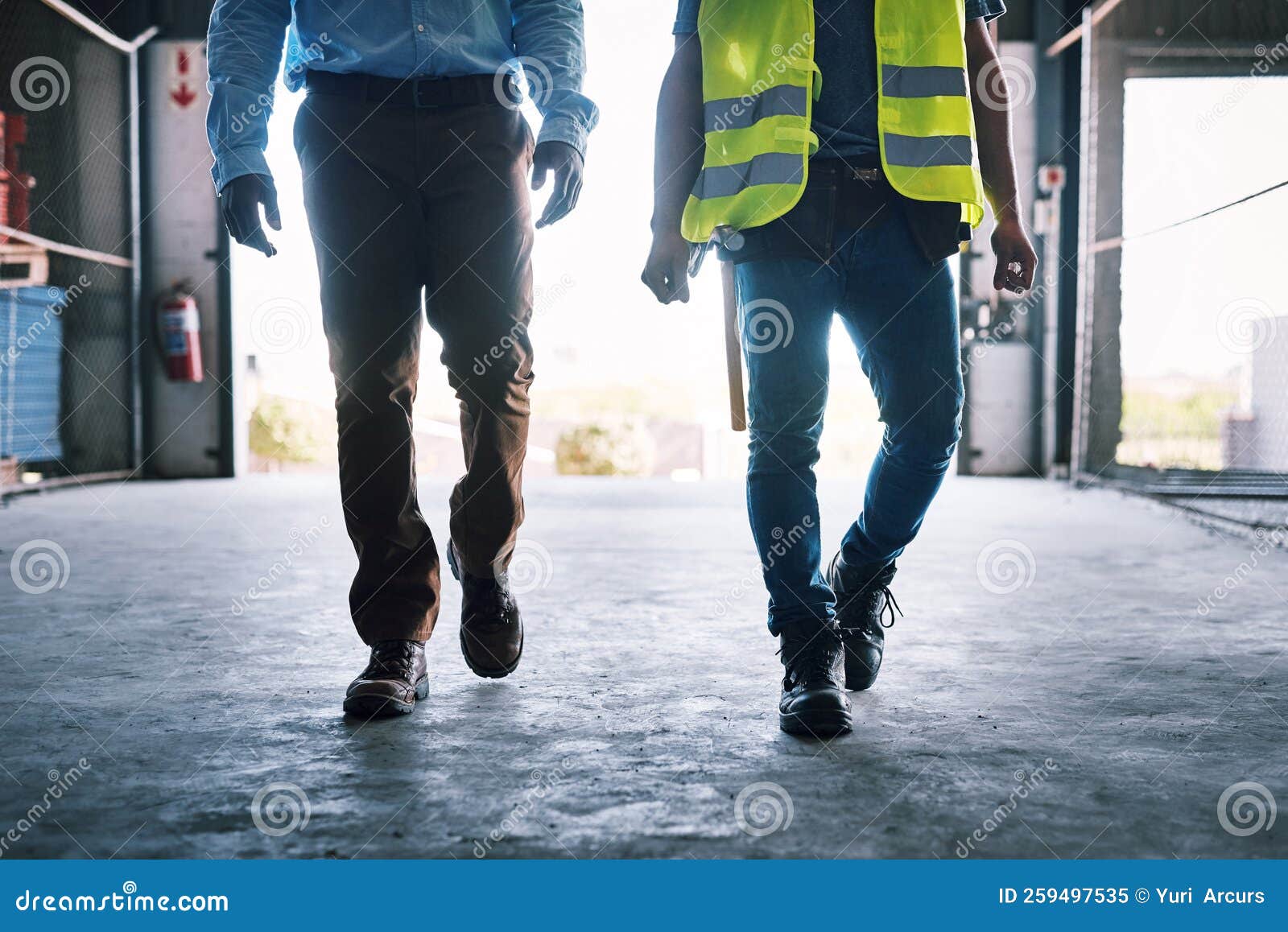 Progress is a Process. Two Unrecognisable Builders Walking through a ...
