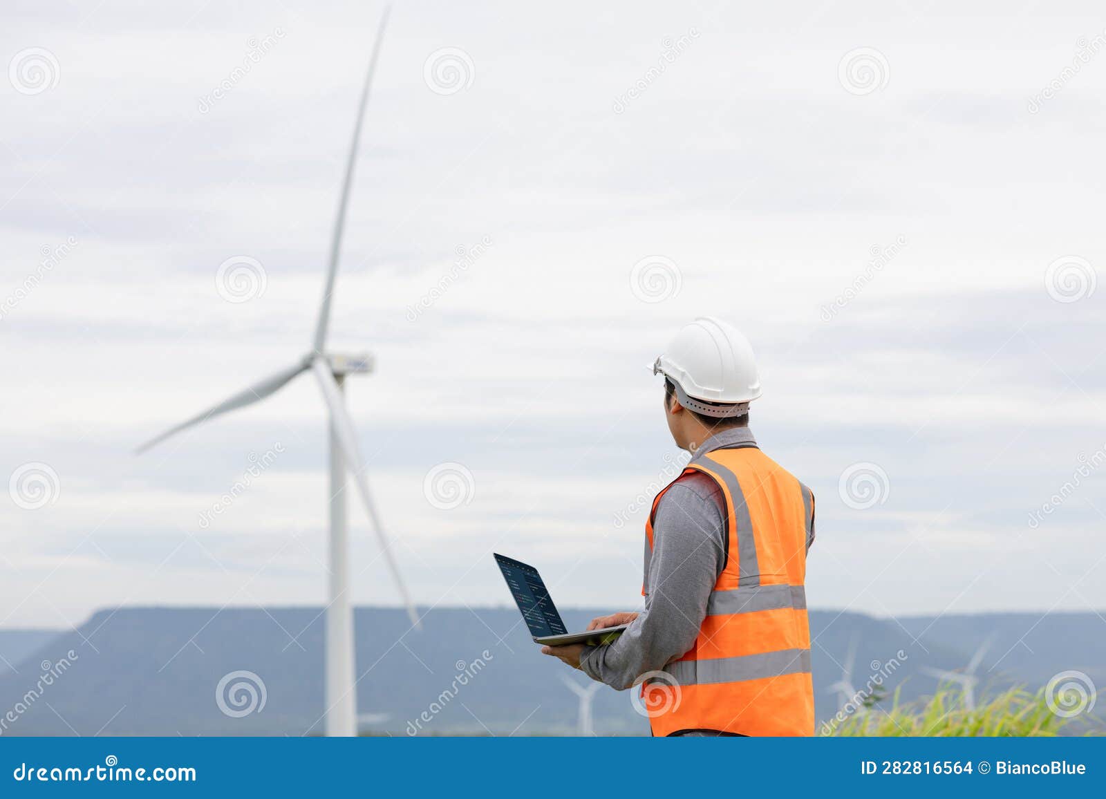 Progressive Concept of Engineer Working in the Wind Farm Atop of the ...