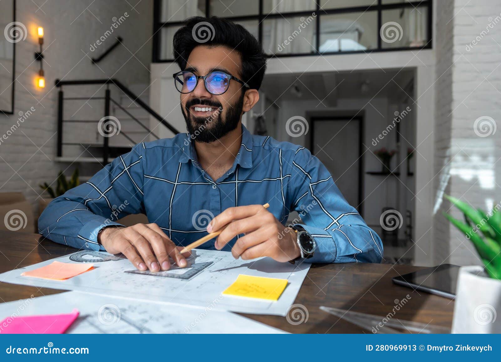 Dark-haired Young Man Sitting at the Table and Preparing a Project ...