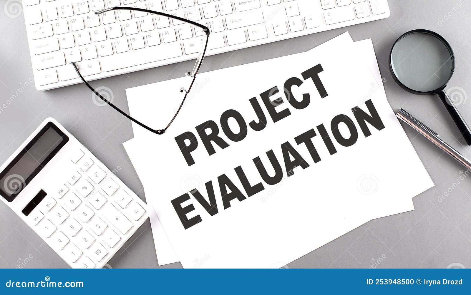 PROJECT EVALUATION Text on Paper with Keyboard, Calculator on Grey ...