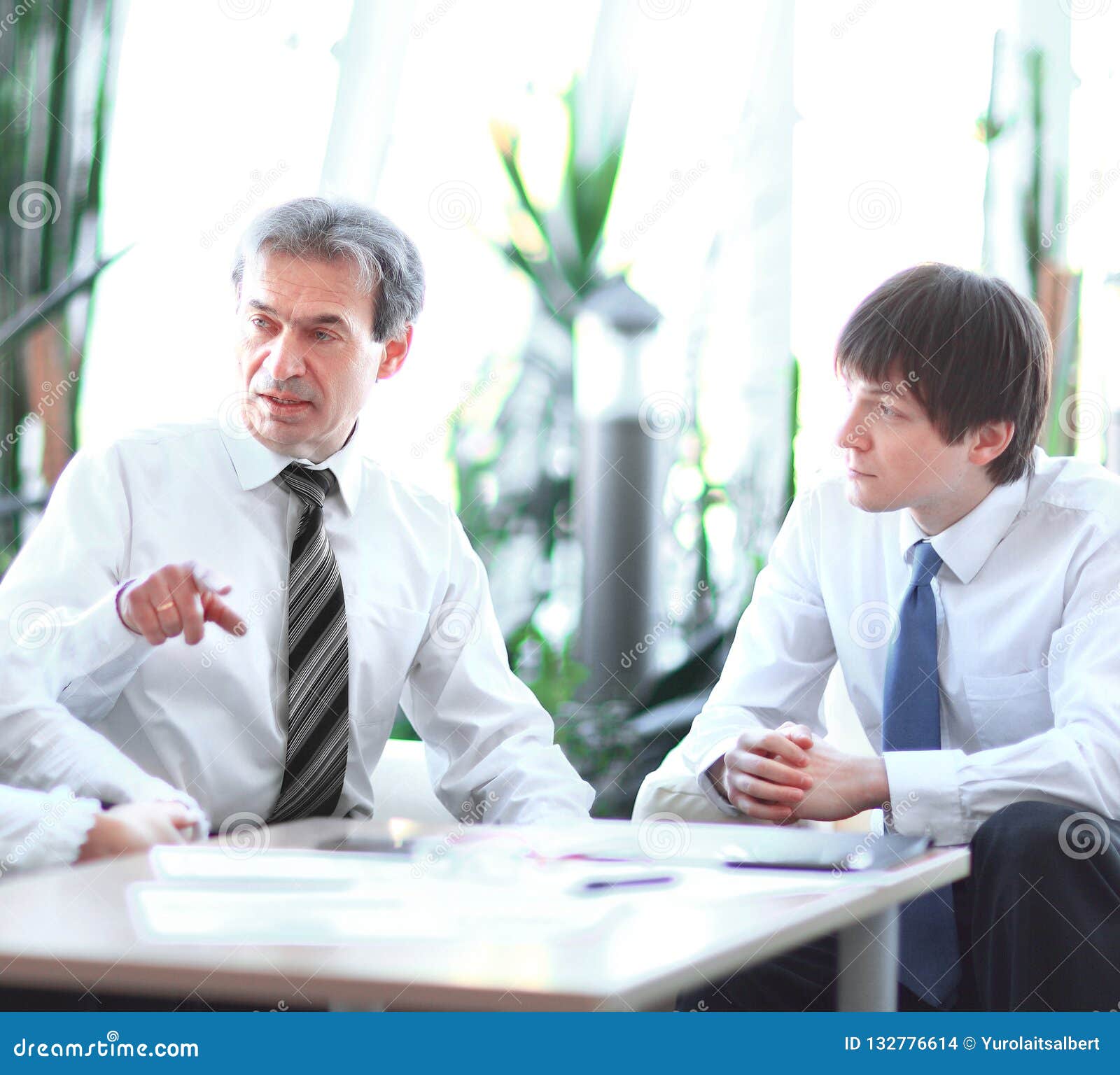 Project Leader Talking To Business Team in the Workplace. Stock Photo ...