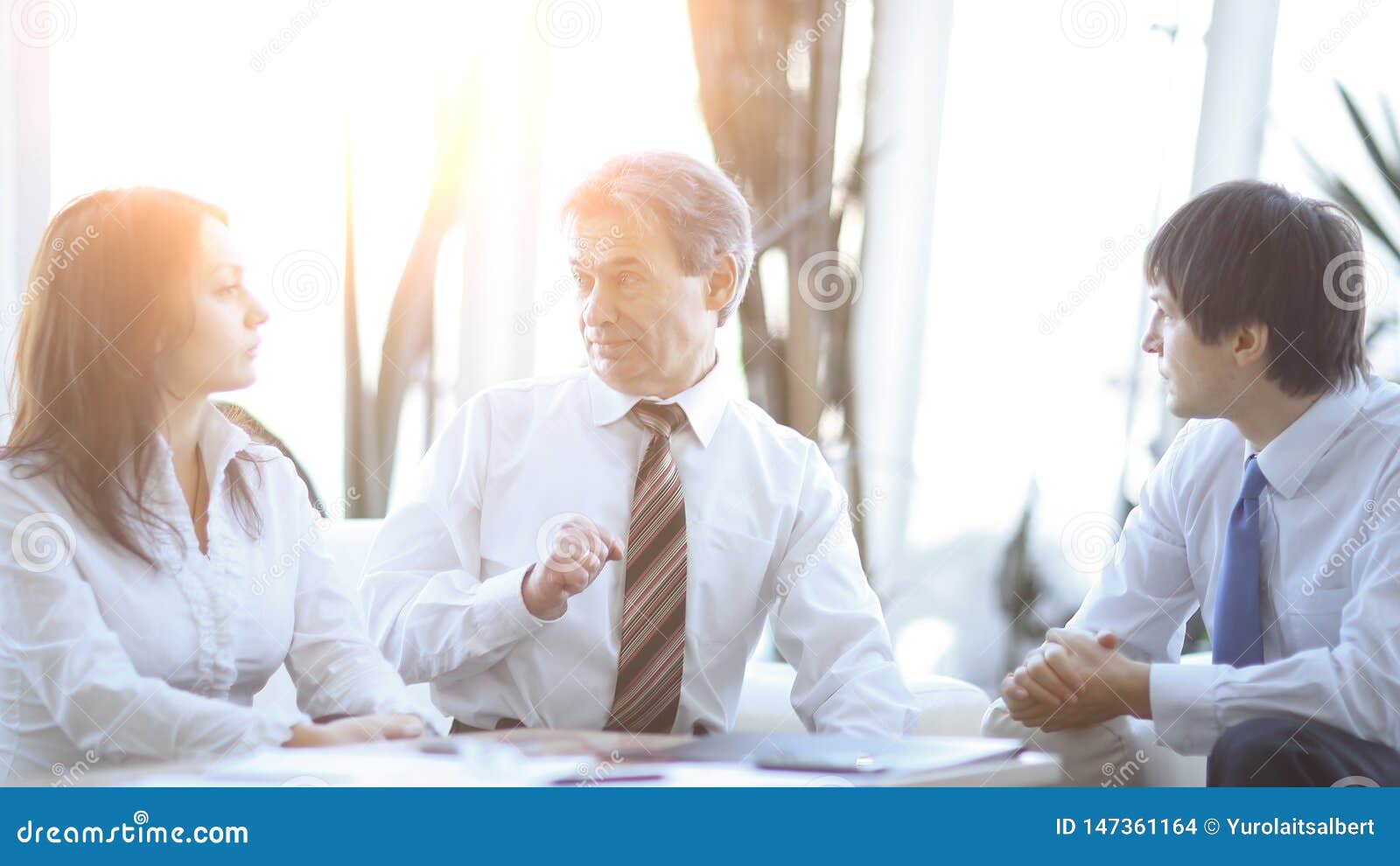 Project Leader Talking To Business Team in the Workplace. Stock Photo ...