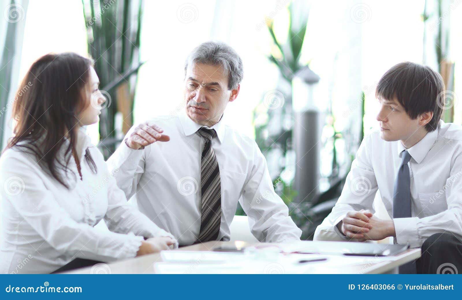 Project Leader Talking To Business Team in the Workplace. Stock Photo ... Project Leader Talking To Business Team in the Workplace. Stock Photo ...