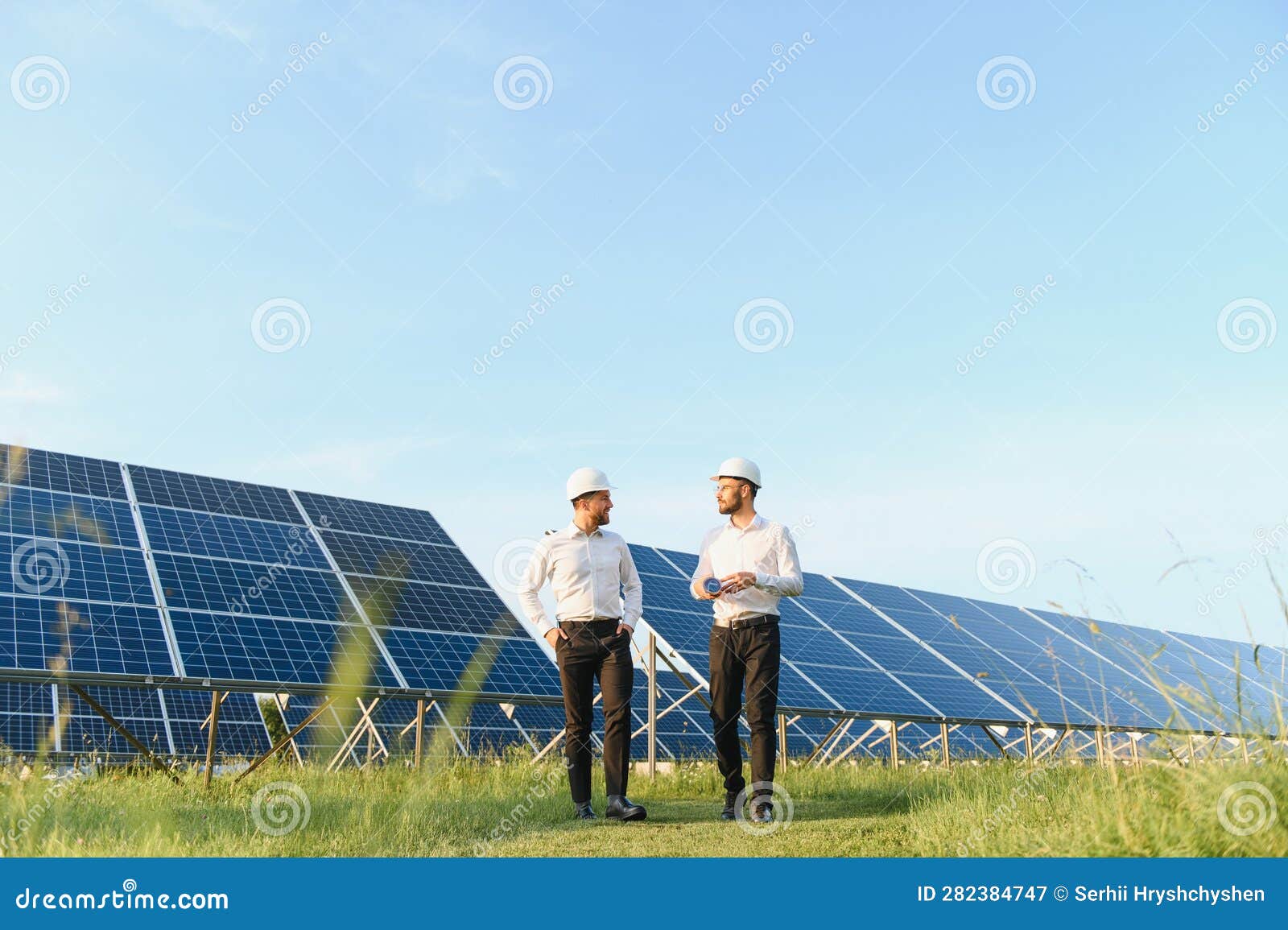 Project Manager Discuss with Worker Installation Process of Solar Panel ...