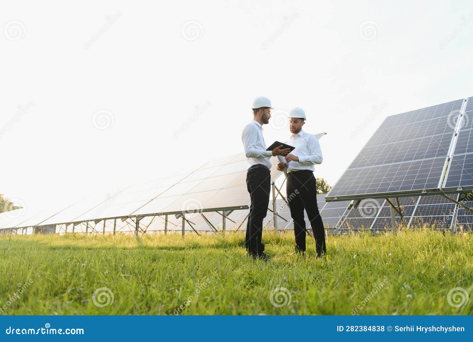 Project Manager Discuss with Worker Installation Process of Solar Panel ...