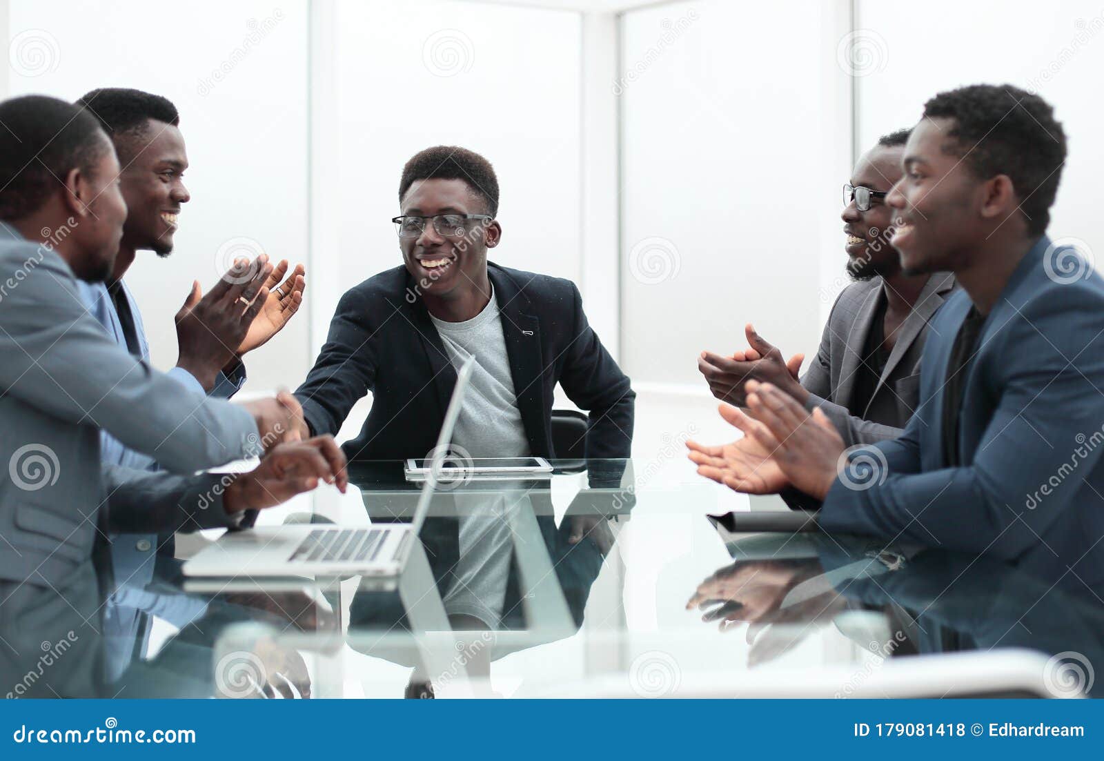 Project Manager Explaining Something To Employees at an Office Meeting ...