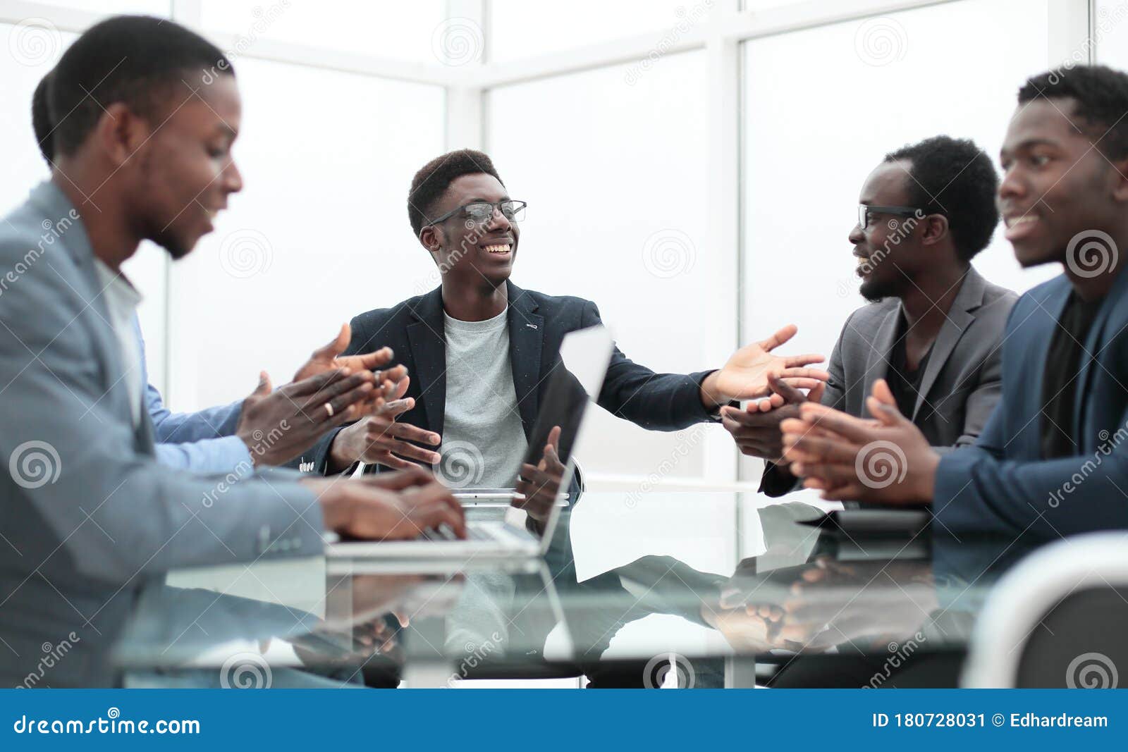 Project Manager Explaining Something To Employees at an Office Meeting ...