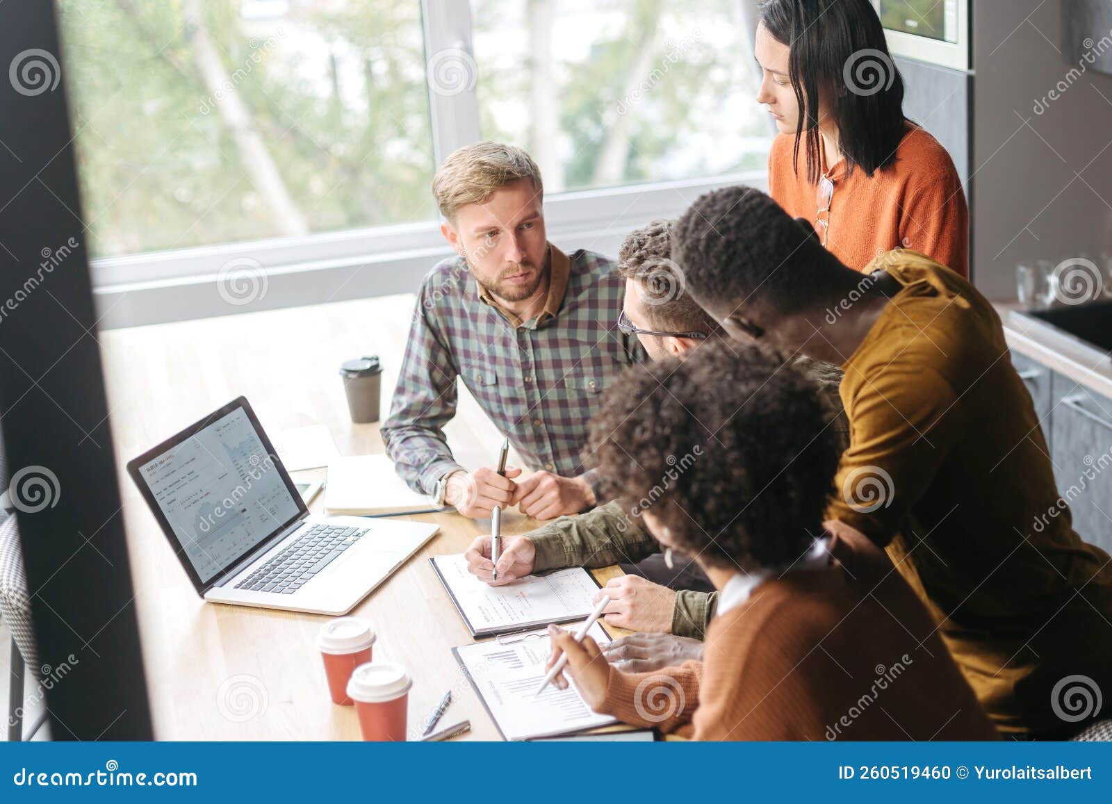 Project Manager is Explaining Something To Young Employees . Stock ...