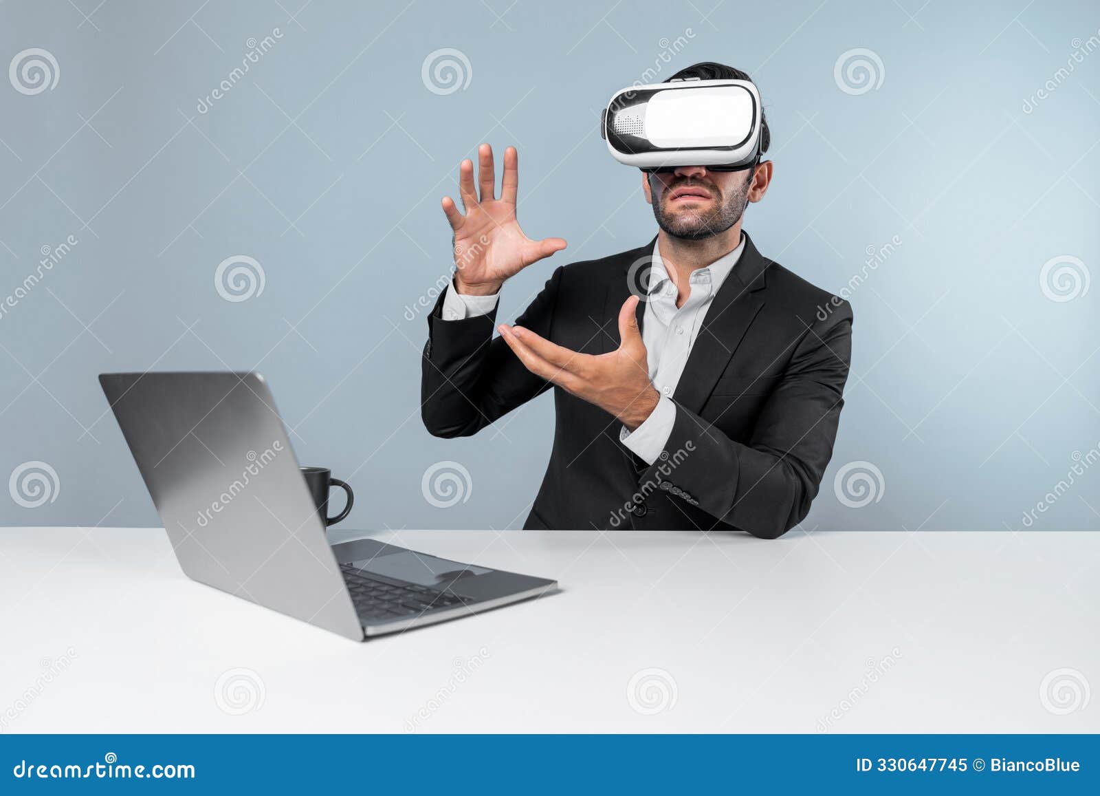 Project Manager Looking by Using VR Goggle while Sitting at Laptop ...