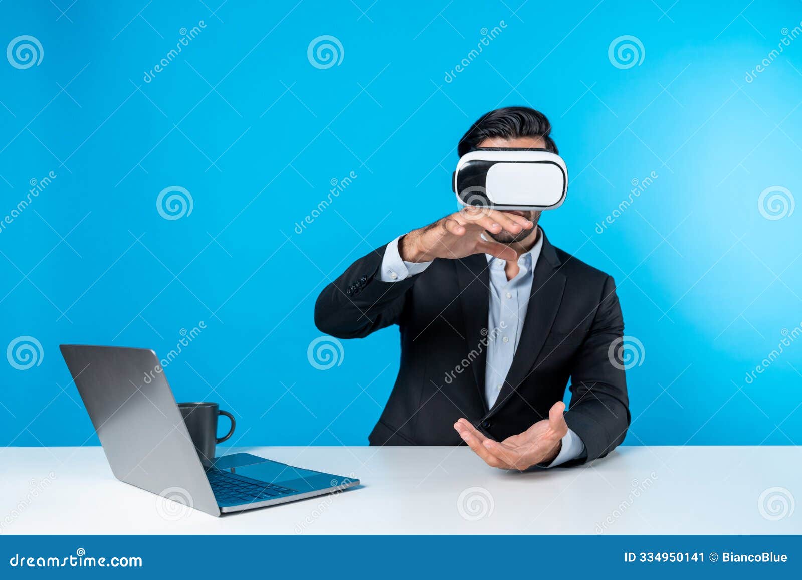 Project Manager Looking by Using VR Goggle while Sitting at Laptop ...