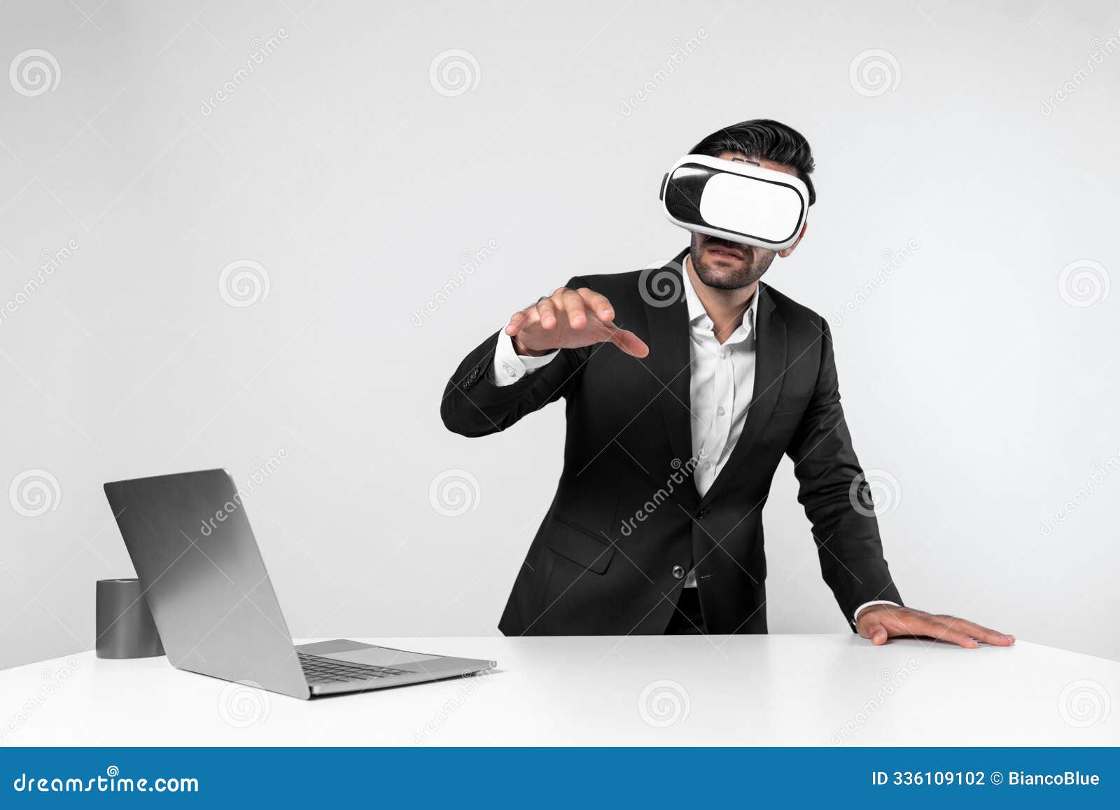 Project Manager Looking by Using VR Goggle while Sitting at Laptop ...