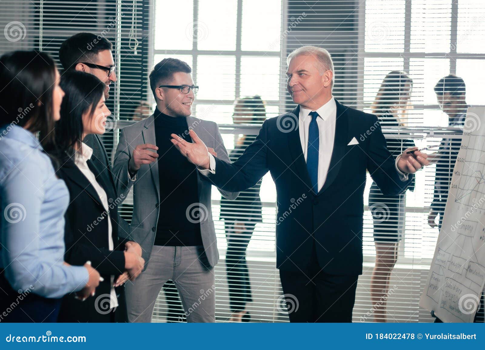 Project Manager and Working Group Standing in the Conference Room ...