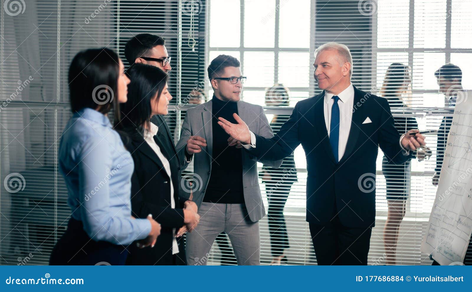Project Manager and Working Group Standing in the Conference Room ...