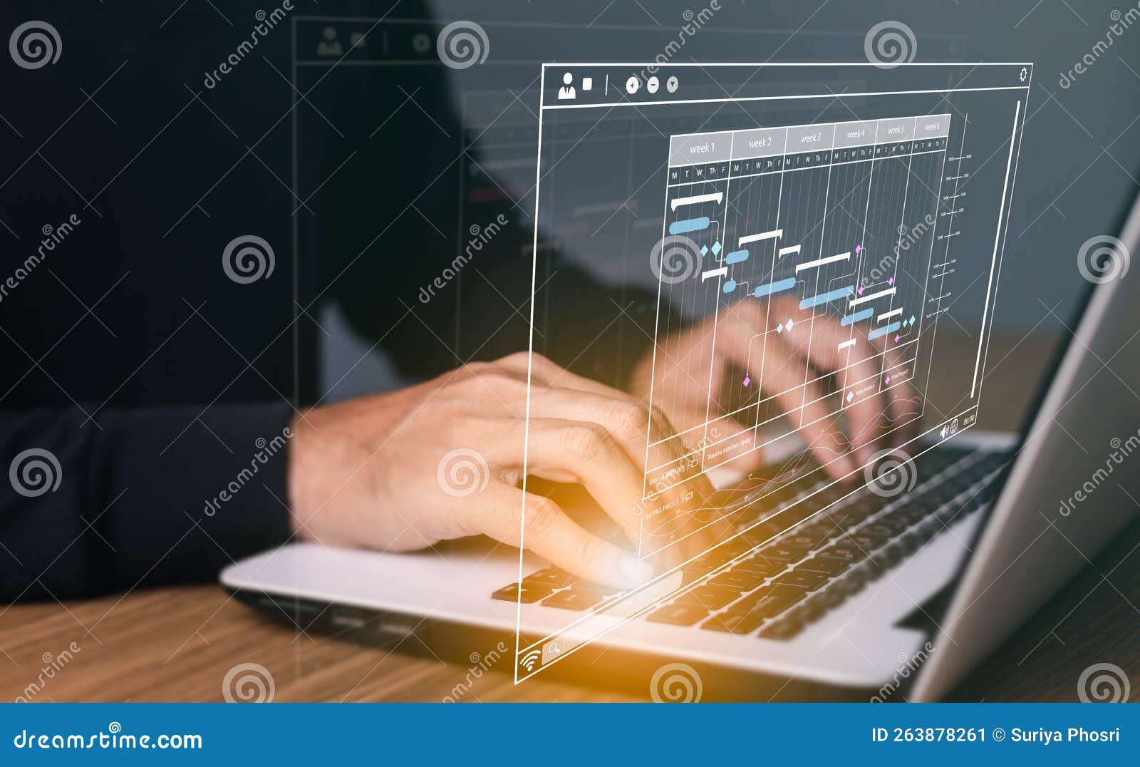 Project Manager Working on Laptop and Updating Tasks and Milestones ...