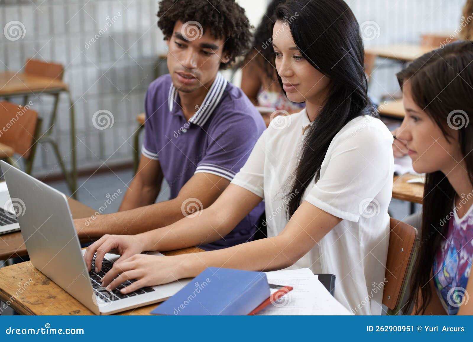 Project Partners. a Group of University Students Working on Laptops in ...