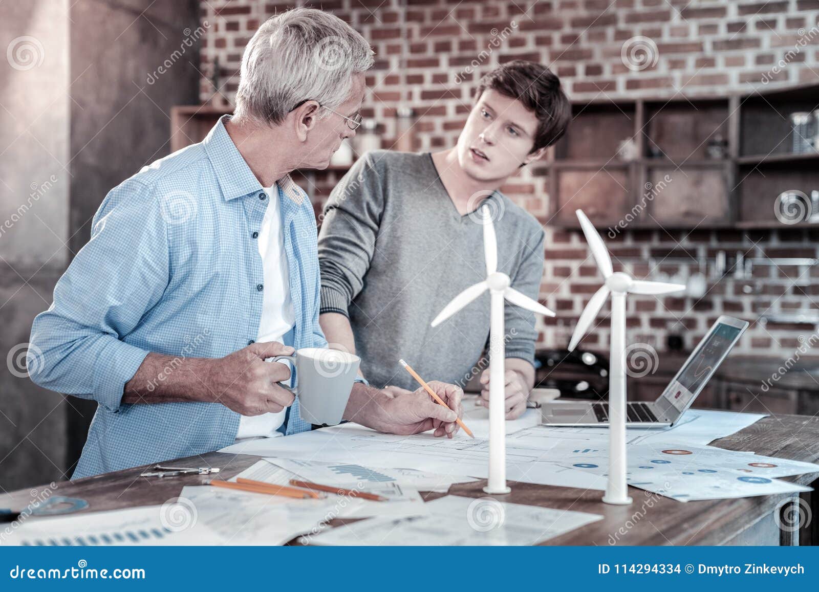 Pensive Male Engineers Sharing Experience Stock Photo - Image of ...