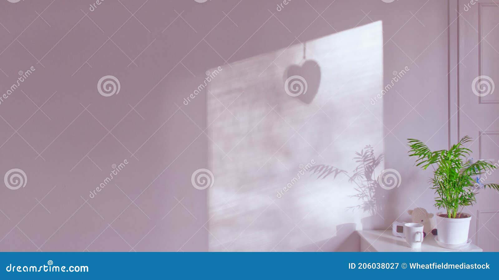Projection of Heart-shaped Pattern on Wall, Green Plants, Purple ...