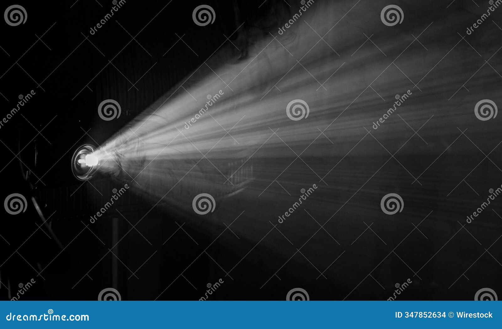 Projector Beam Casting Light in a Dark Room Stock Photo - Image of ...
