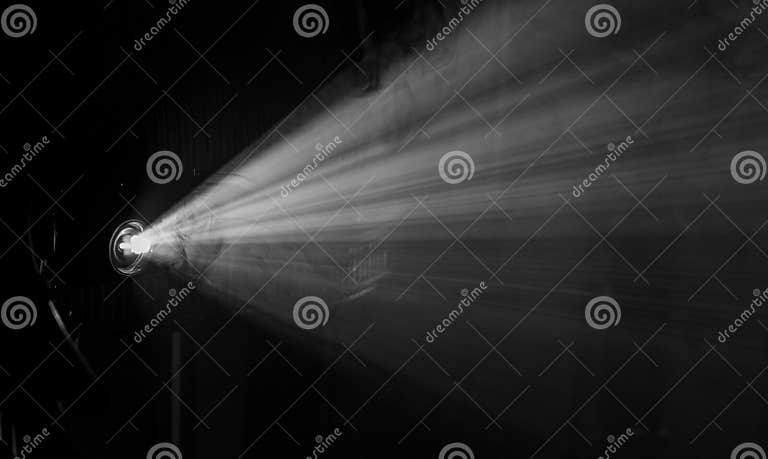 Projector Beam Casting Light in a Dark Room Stock Photo - Image of ...
