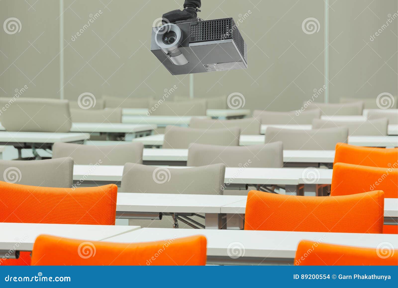 A Projector Over Empty Seats with Tables in a Conference Hall. Stock ...