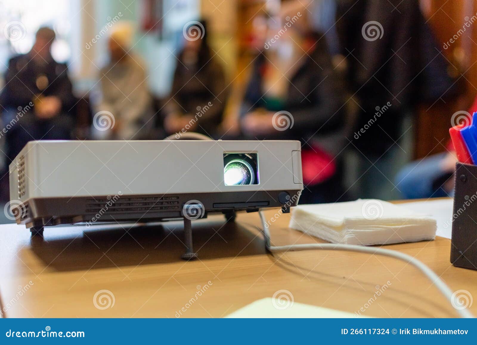 Projector for Presentations on Table on Blurred Background of Classroom ...
