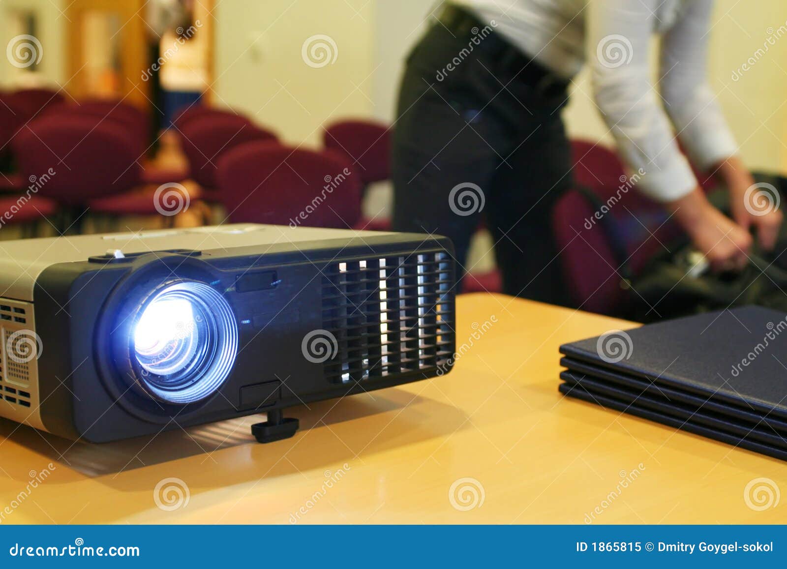 Projector on Table with Person Behind (horizontal) Stock Image - Image ...