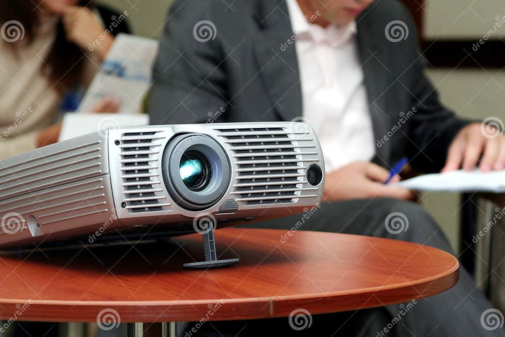 Projector on Table with Two Person Behind Stock Image - Image of ...