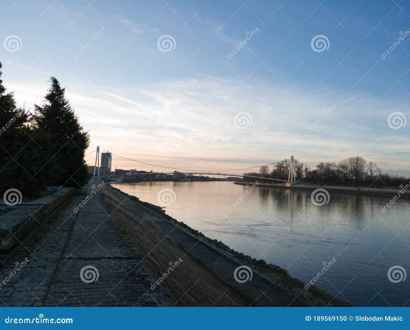 Promenade by the River Drava and Pedestrian Bridge during a Sunny ...