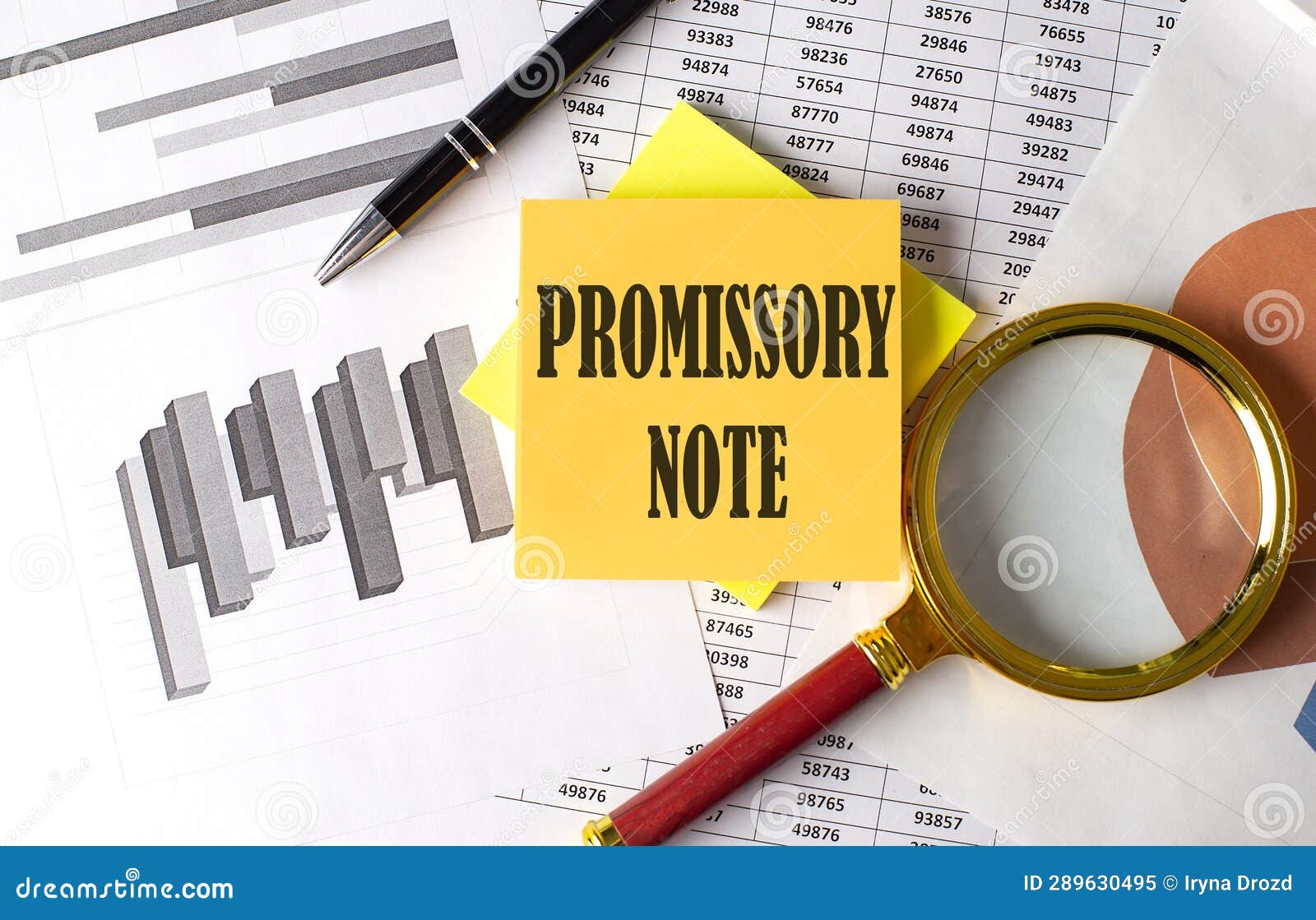 PROMISSORY NOTE Text on a Sticky on Red Notebook on Chart Background ...