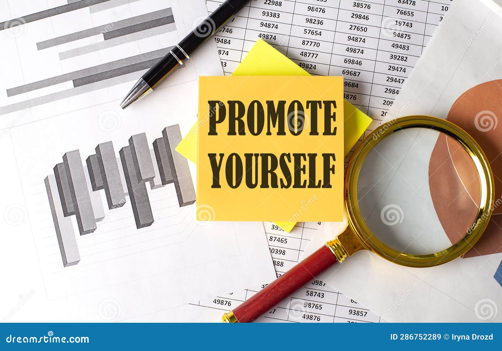 PROMOTE YOURSELF Text on a Sticky on the Graph Background with Pen and ...