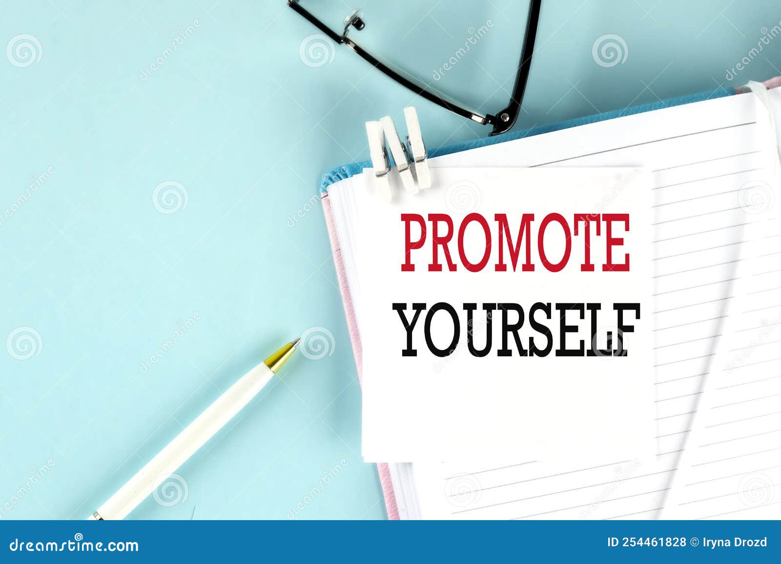PROMOTE YOURSELF Text on a Sticky on Notebook with Pen and Glasses ...