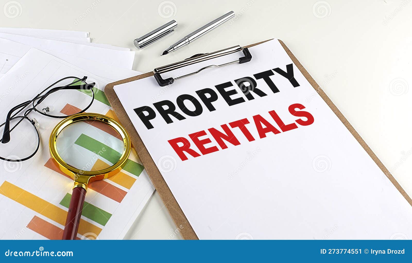 PROPERTY RENTALS Text on Clipboard with Chart on White Background ...