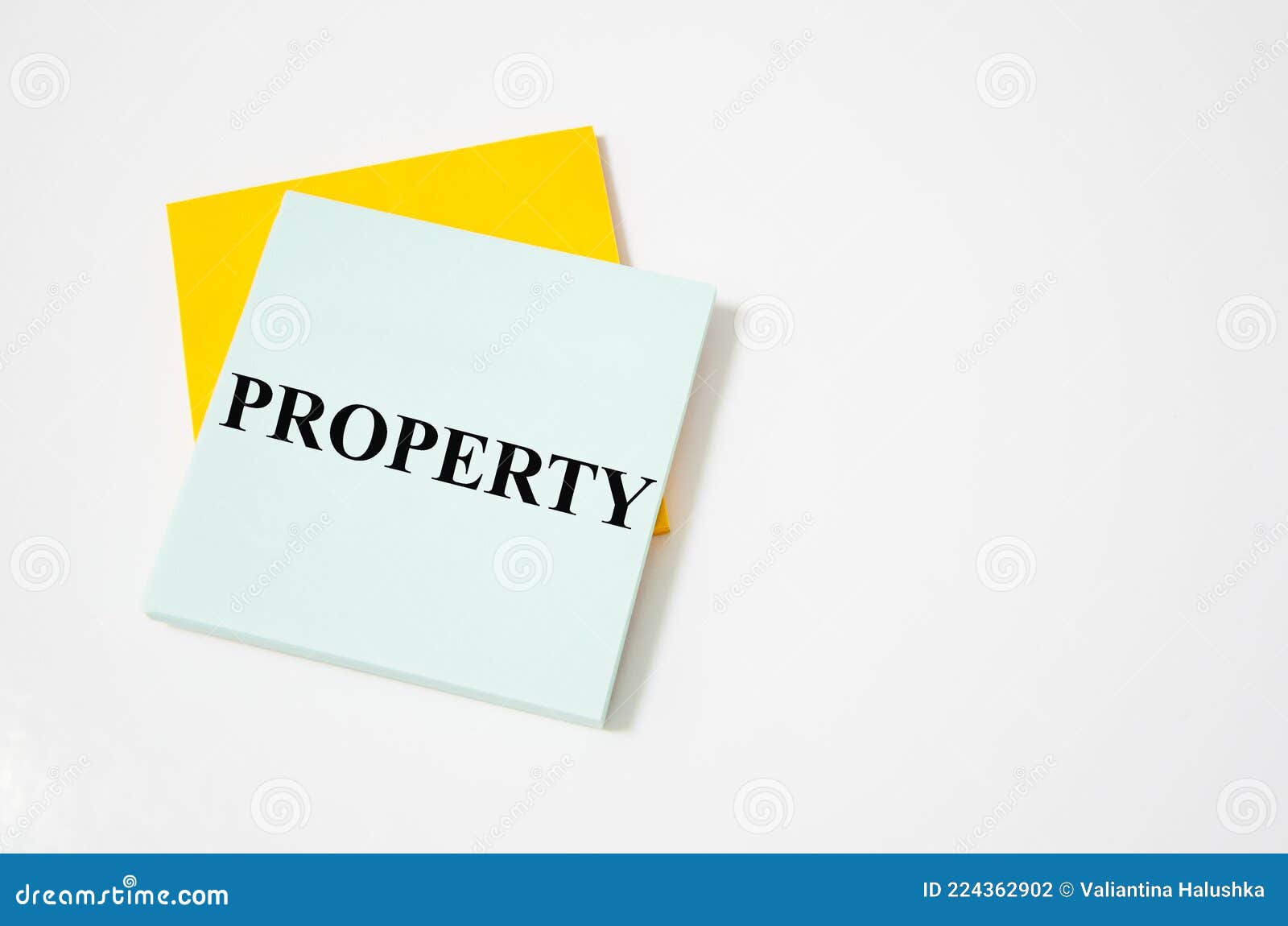 Property Text Written on a White Notepad with Colored Pencils and a ...