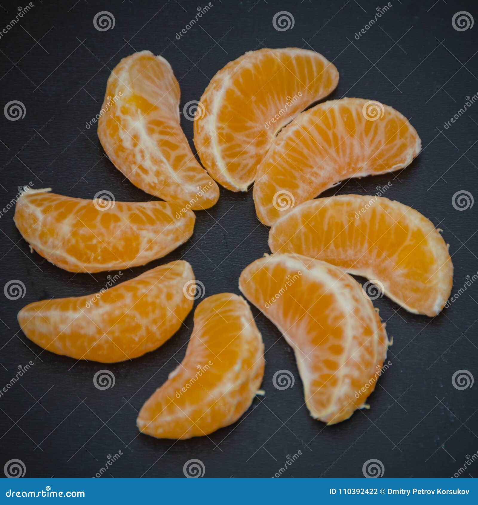 On a Black Background of Mandarin`s Share in the Form of a Circl Stock ...