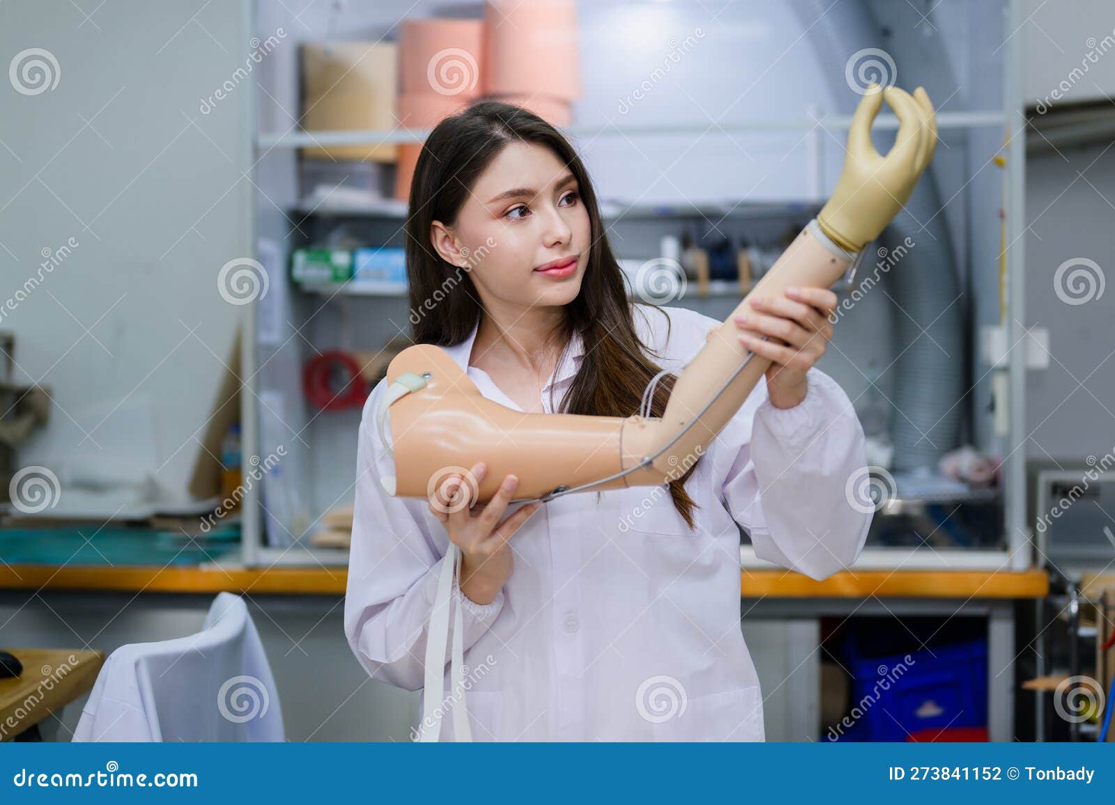 Prosthetic Technician Holding Prosthetic Arm Checking and Controlling ...