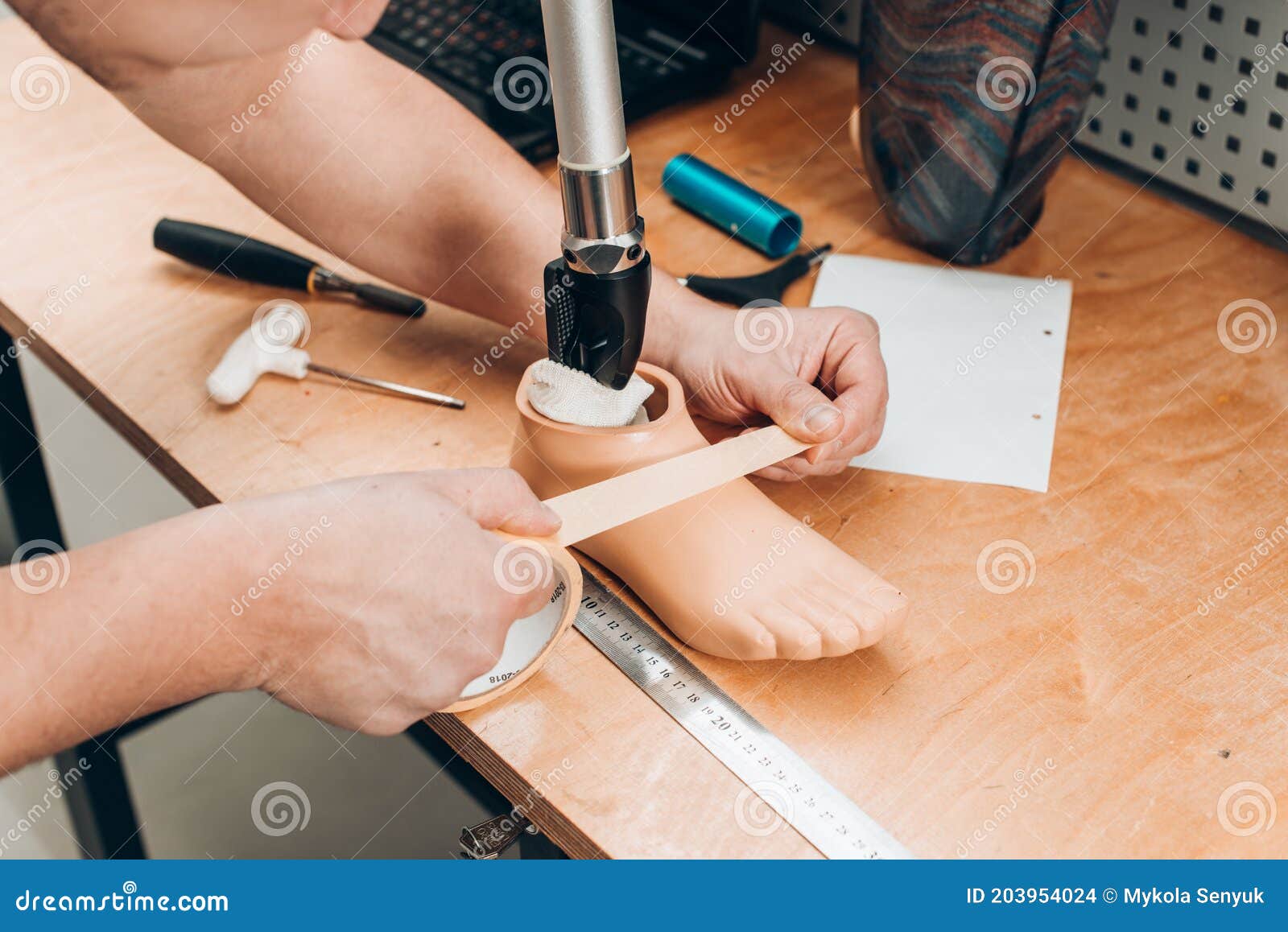 Prosthetics Technician Checking Prosthesis Molds in a Workshop Stock ...