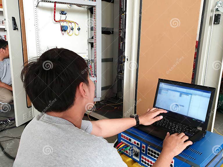 Protection Relay Testing by the Electrical Engineer. Stock Image ...